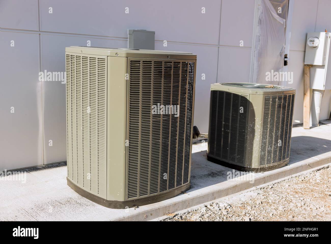 Installed on exterior concrete foundation of house is unit for outside ...