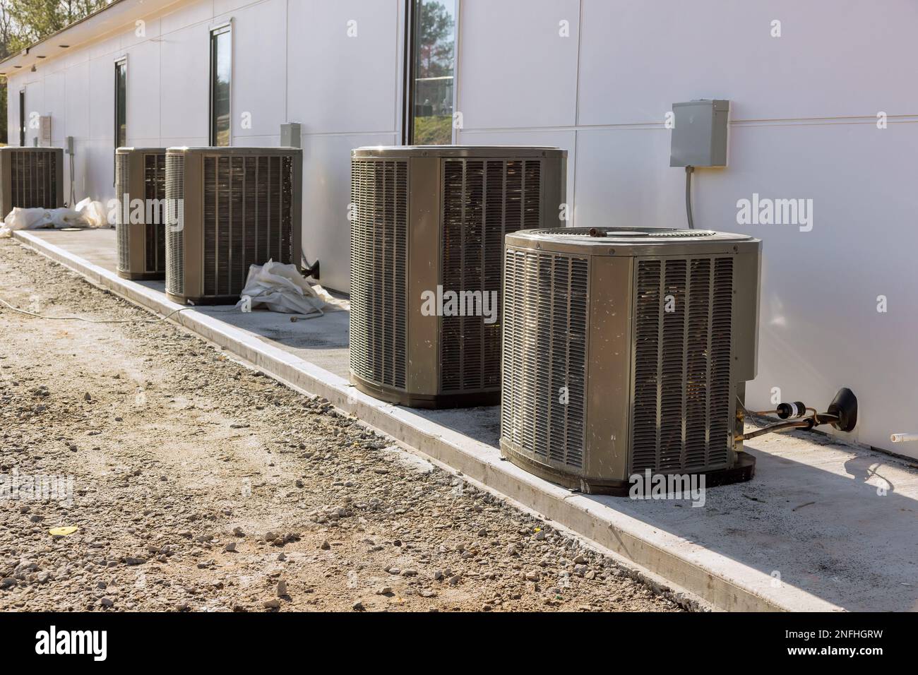 An outdoor air conditioning unit has been installed on house exterior ...