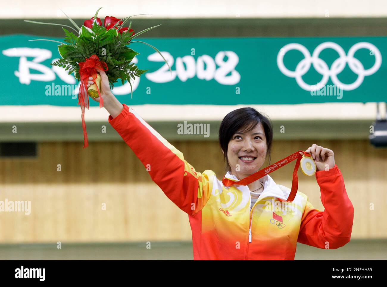 China's Du Li waves during the medal ceremony for the women's 50-meter ...