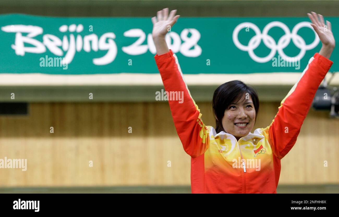 China's Du Li waves during the medal ceremony for the women's 50-meter ...
