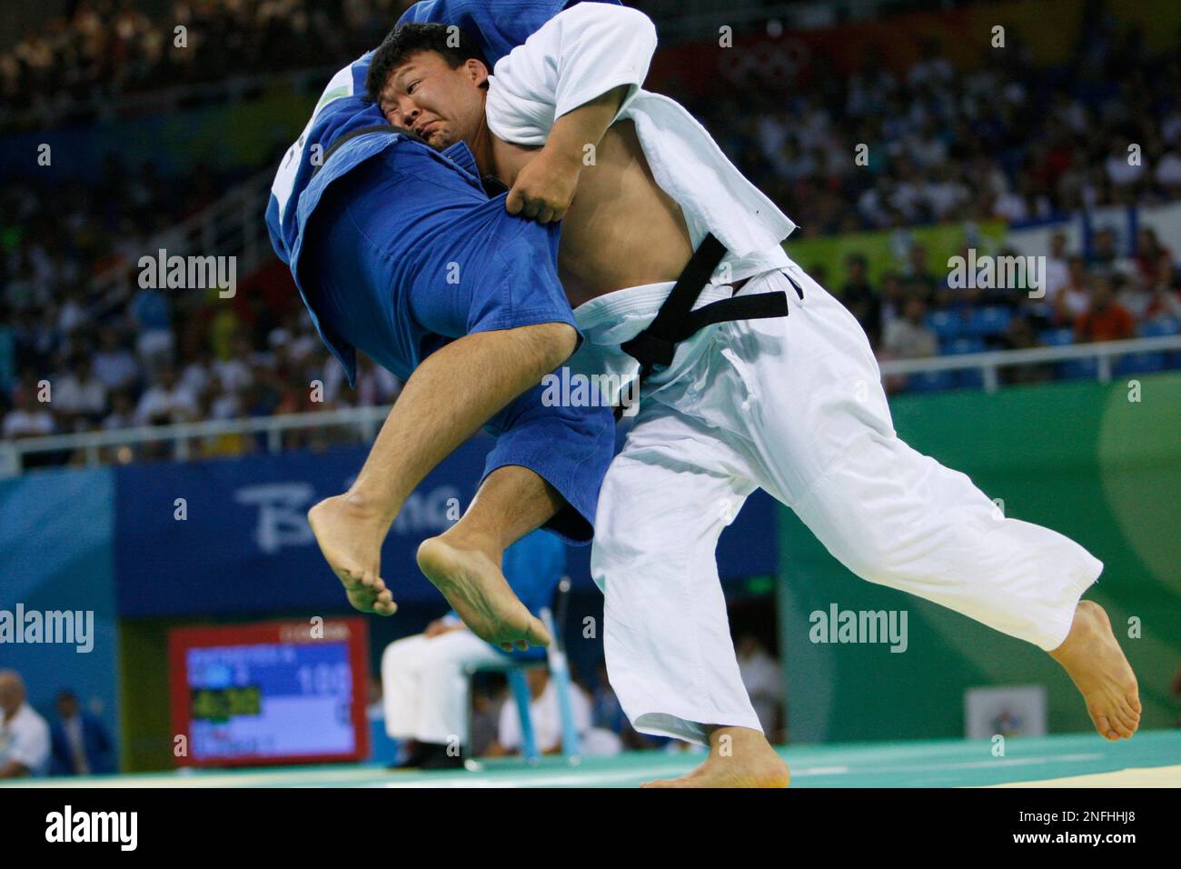 Mongolia's Tuvshinbayar Naidan, white, throws Japan's Keiji Suzuki, the ...