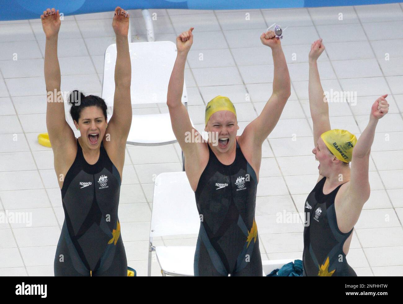 Australian women's 4x200-meter freestyle relay team members celebrate their world record victory ...