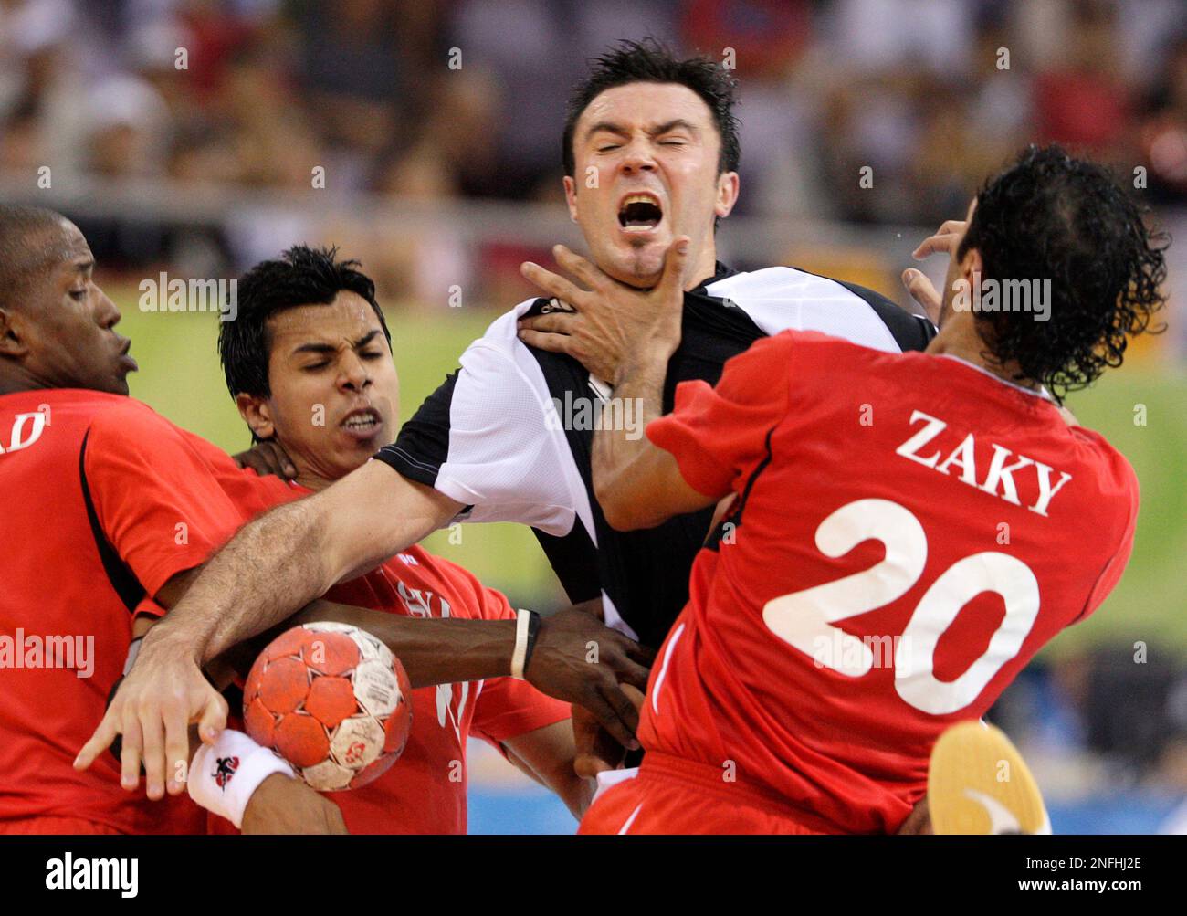 Germany's Andrei Klimovets collides with Egypt's Hussein Zaky, right ...