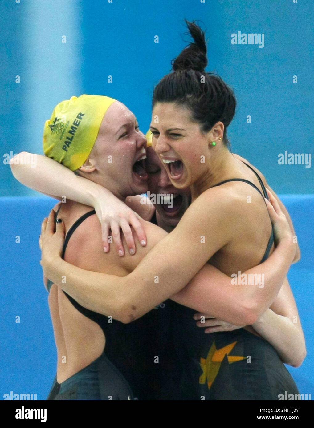 Australia's Kylie Palmer, Bronte Barratt and Stephanie Rice, from left, celebrate setting a new ...