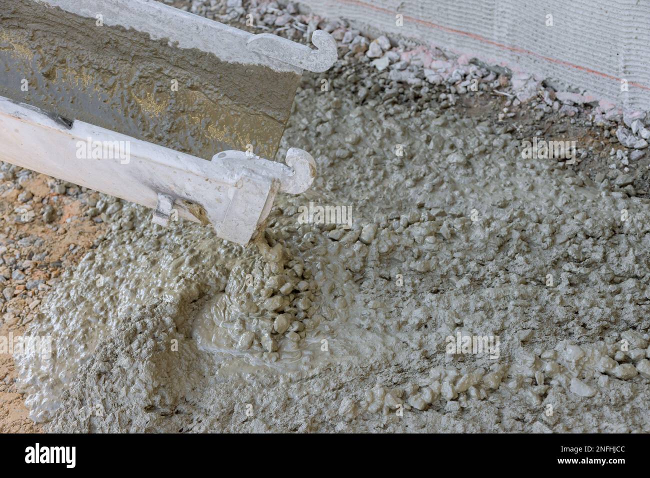 During construction new home to concrete mixing truck pours out ...