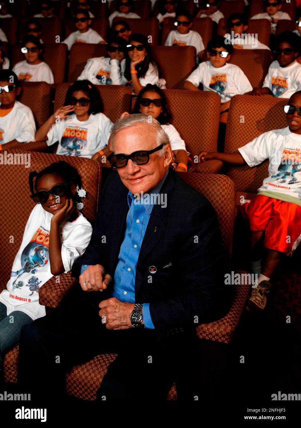 Astronaut Buzz Aldrin poses for a photo with children from Los Angeles ...