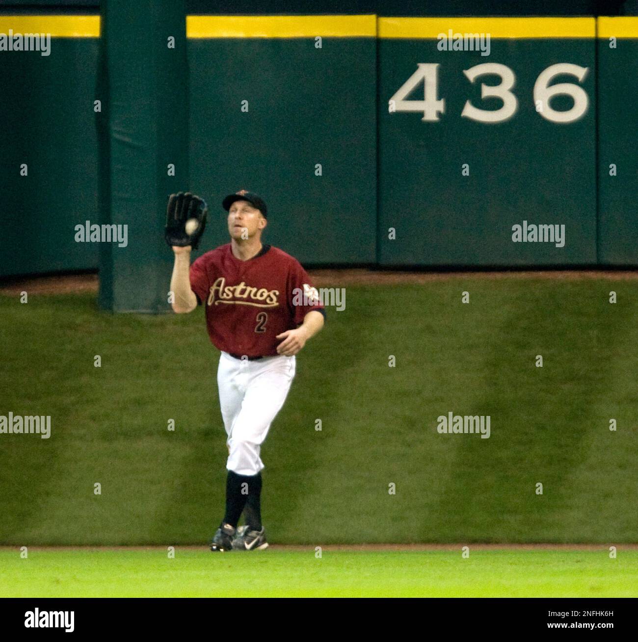 Houston Astros center fielder Darin Erstad makes a catch at the warning ...