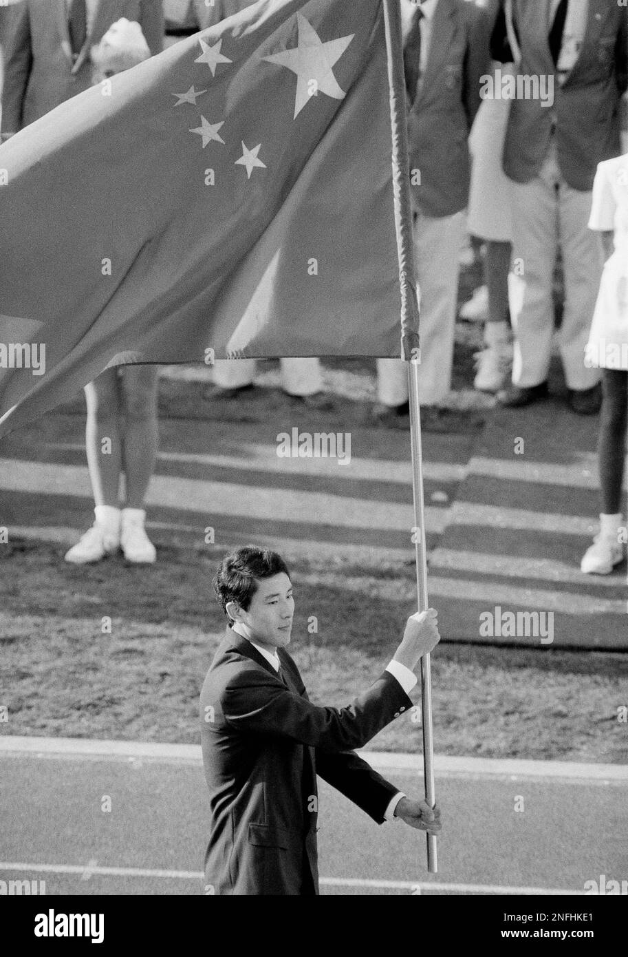 Basketball player Libin Wang bears the flag of China during the team's ...