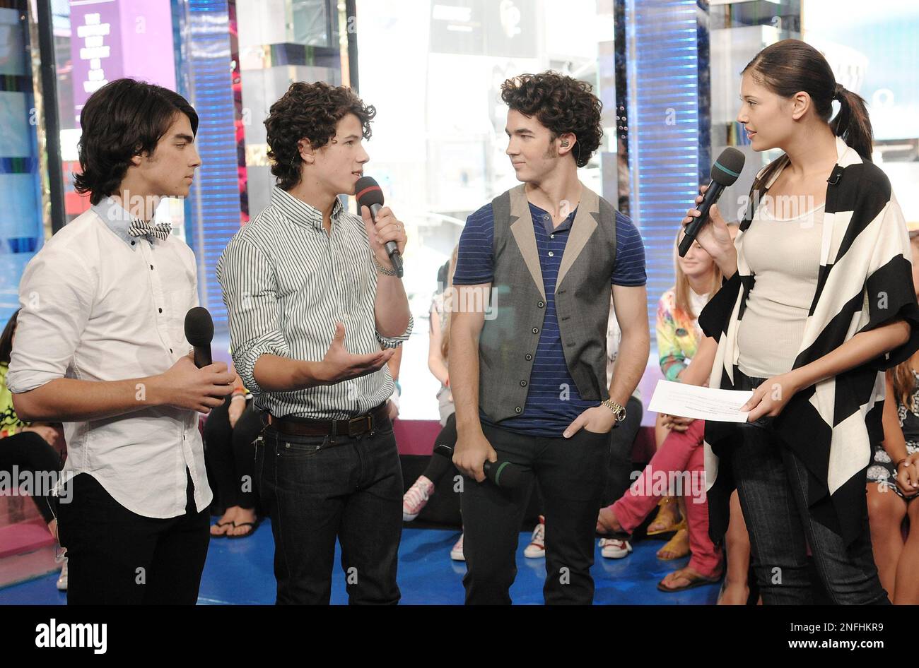 The Jonas Brothers, from left, Joe, Nick and Kevin chat with VJ Lyndsey ...