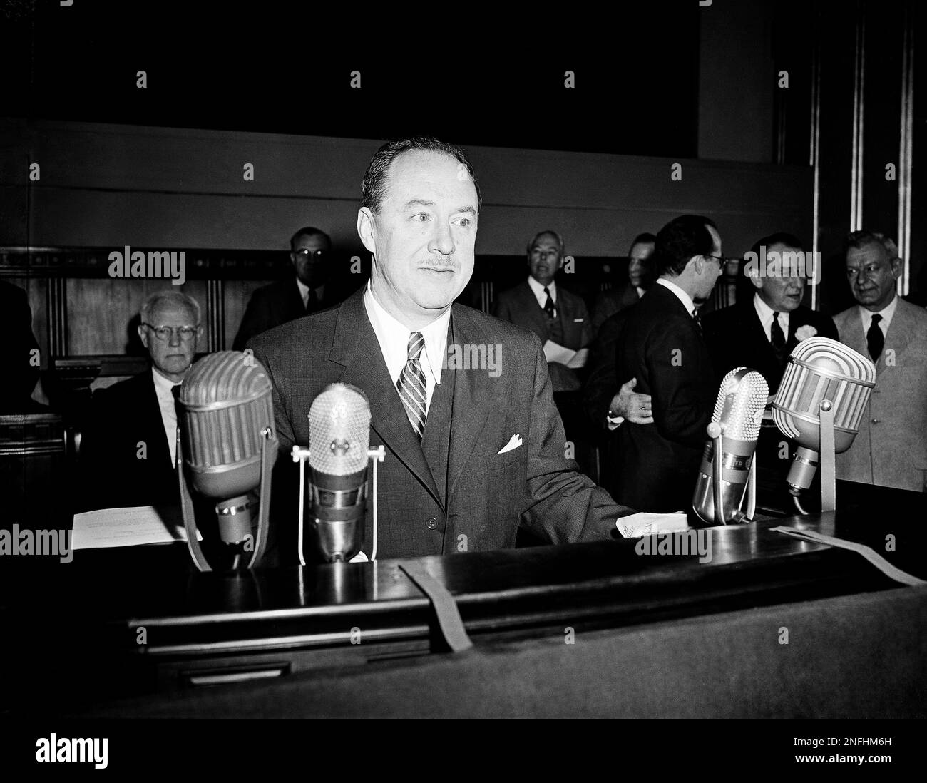 Dr. Thomas Francis, Jr., is shown in front of microphones prior to ...