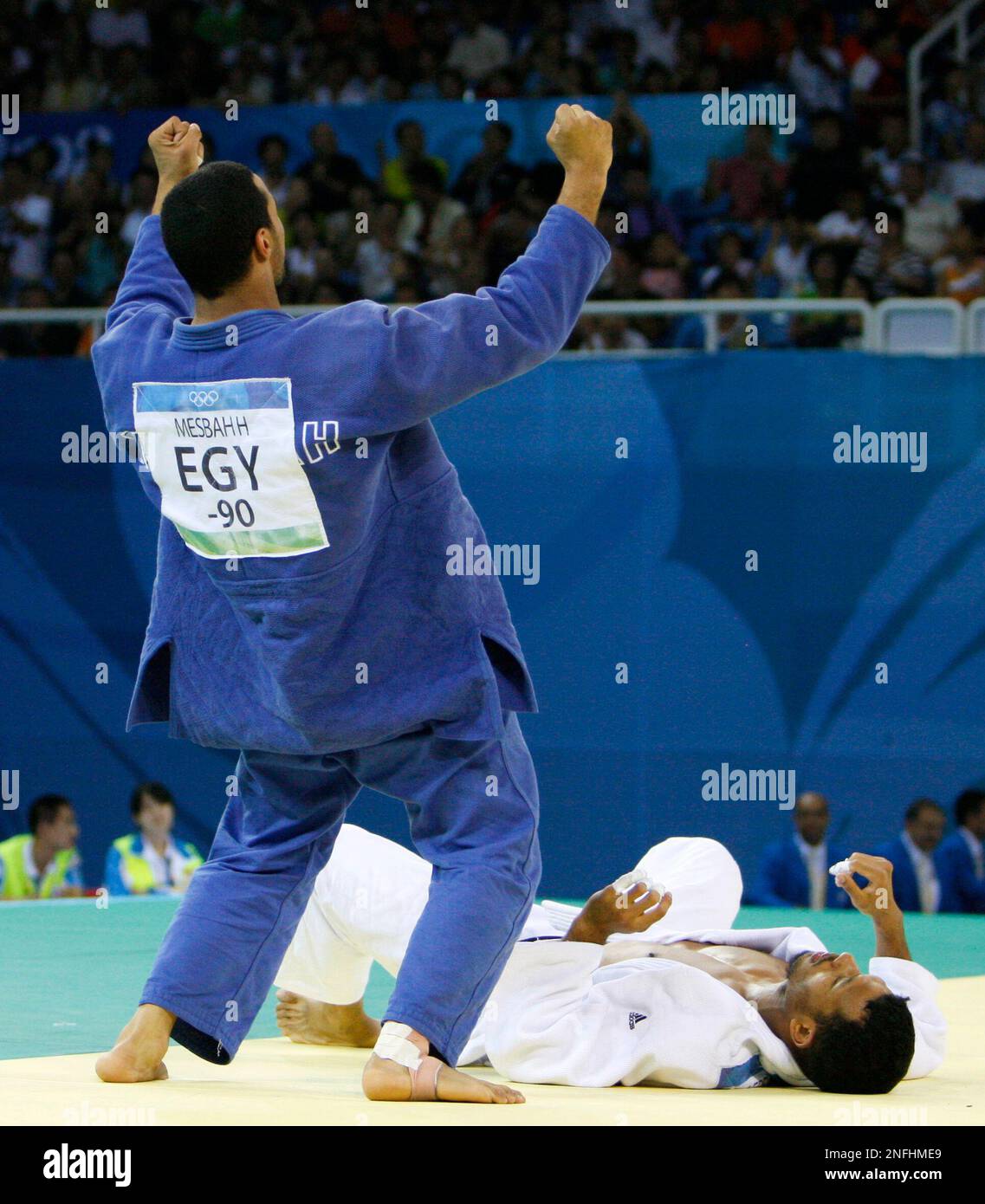 Hesham Mesbah of Egypt, left, celebrates after beating Yves-Matthieu ...