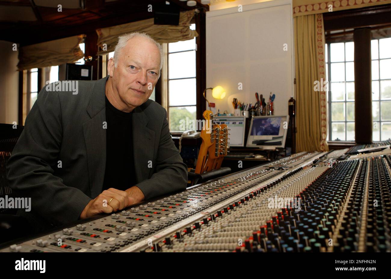 Former British Pink Floyd band member David Gilmour stands over the ...