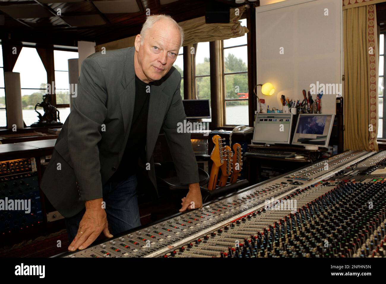 Former British Pink Floyd band member David Gilmour stands over the ...
