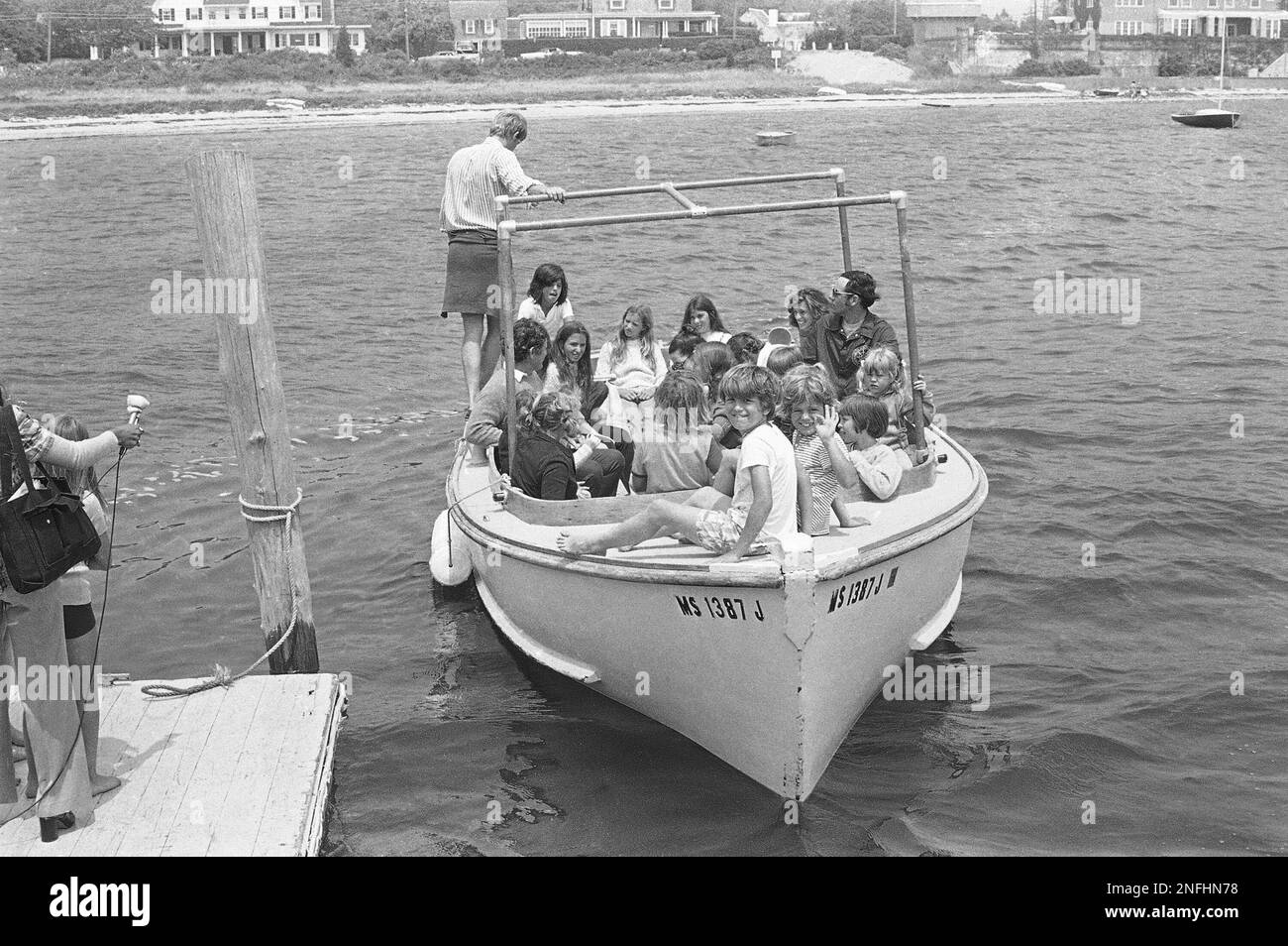 Massachusetts Senator Edward M. Kennedy is surrounded by children of ...