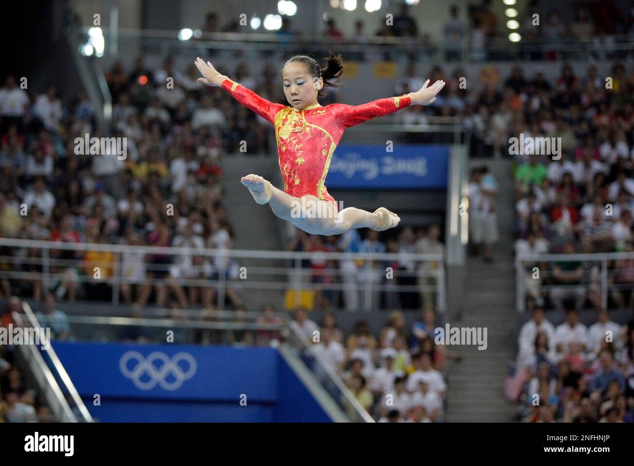 China's Deng Linlin performs on the balance beam during the women's ...