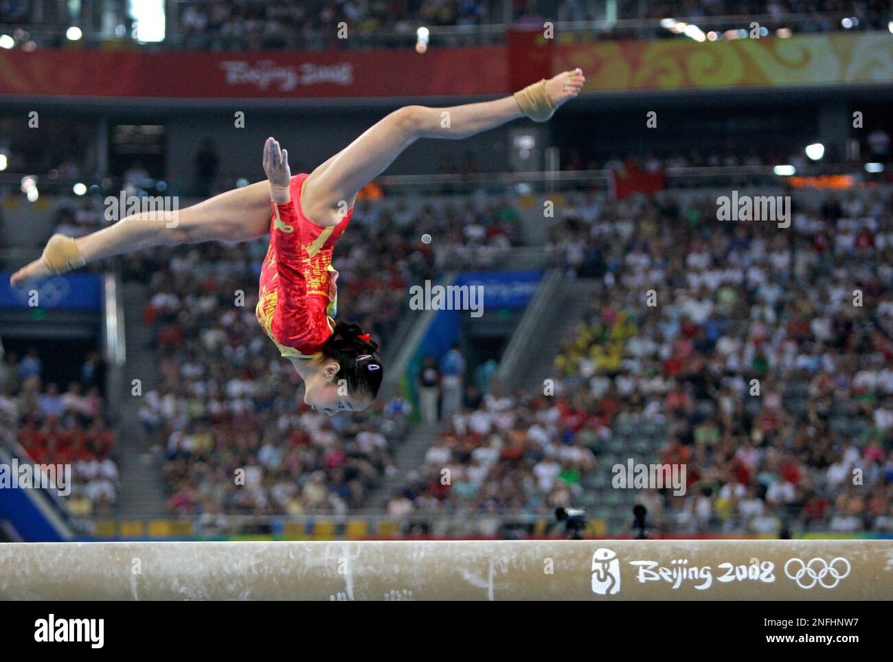 China's Cheng Fei competes on the balance beam during the gymnastics ...