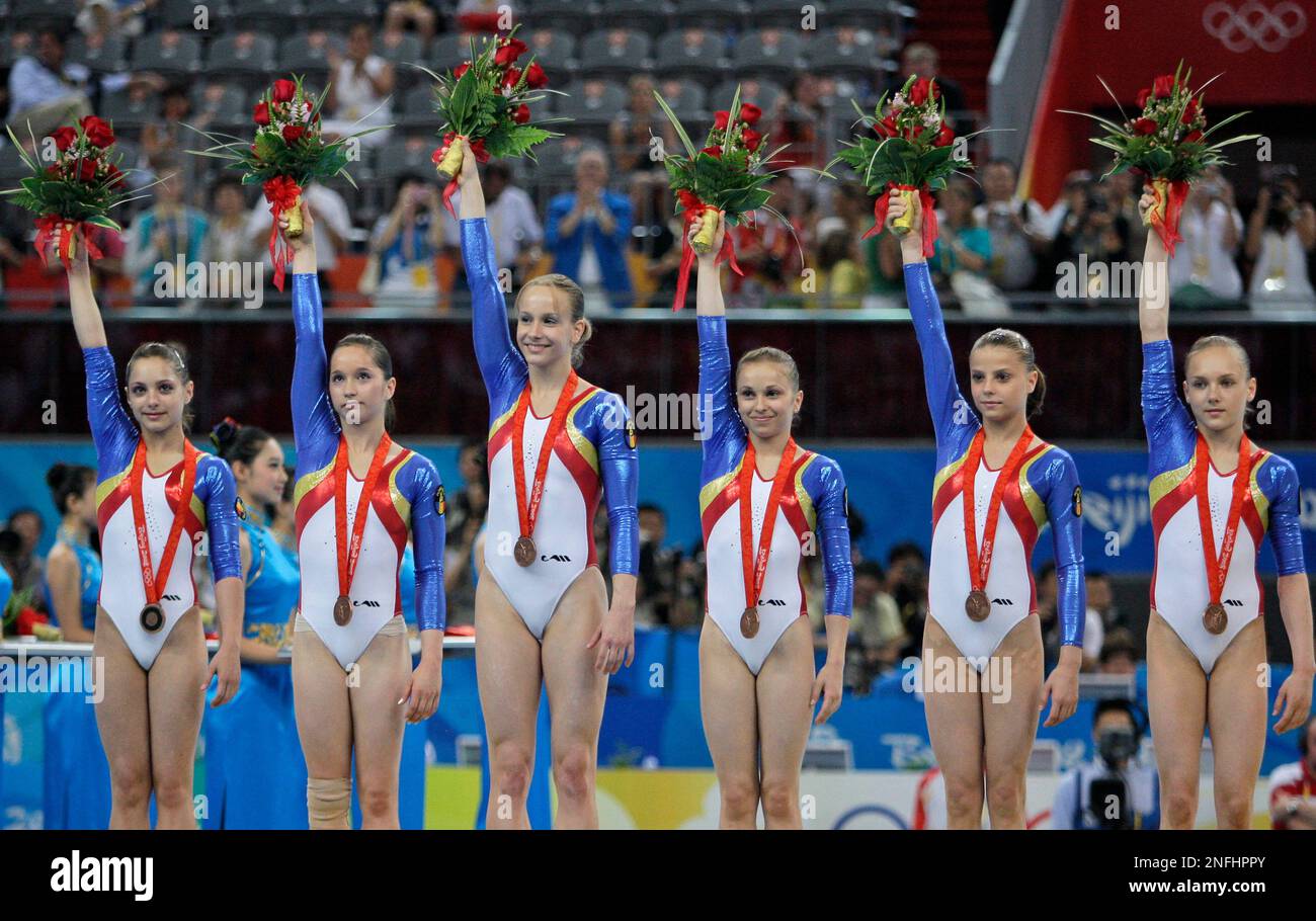 Members of Romania's gymnastics team, from left: Anamaria Tamirjan ...