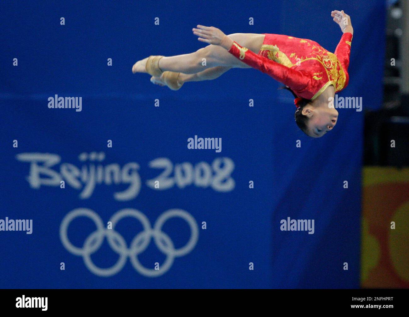 China's gymnast Deng Linlin performs on the balance beam during the ...