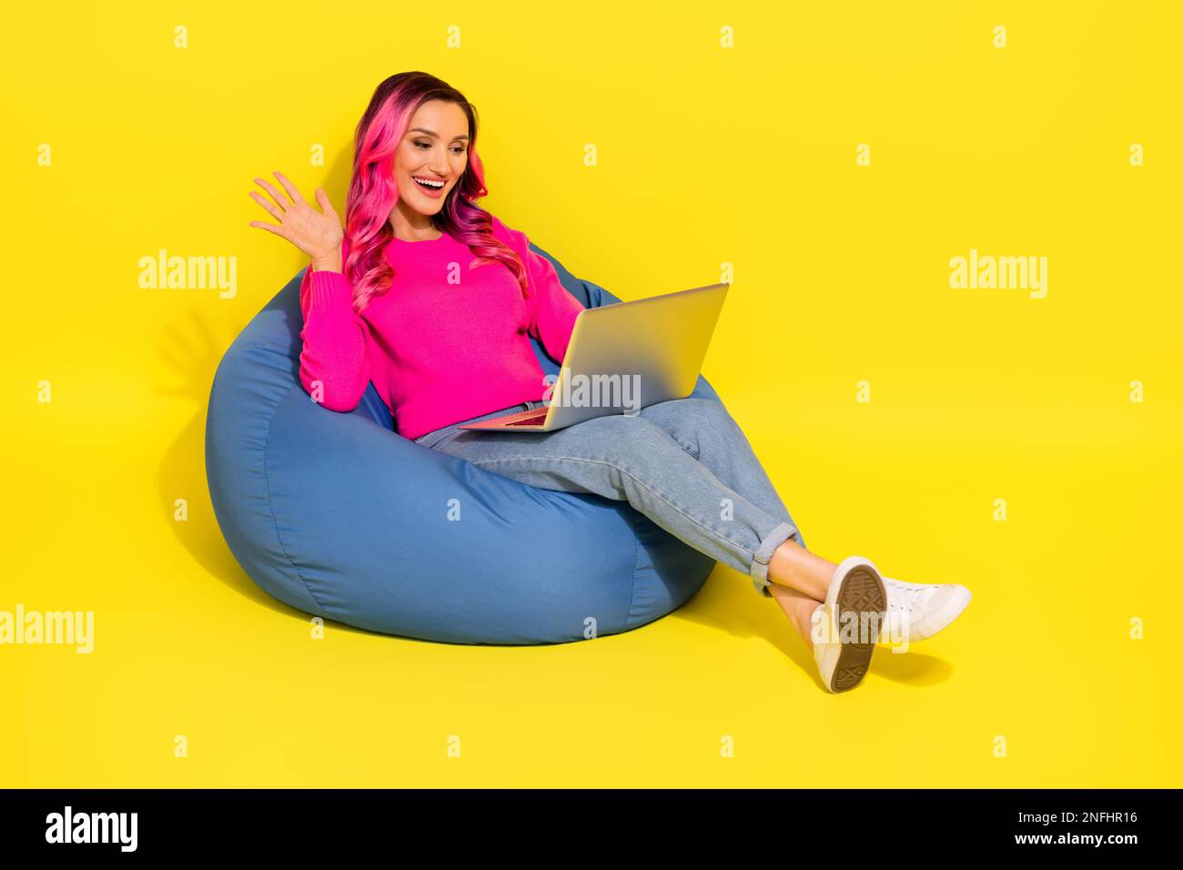 Full body portrait of excited funny lady sit comfy bag use netbook ...