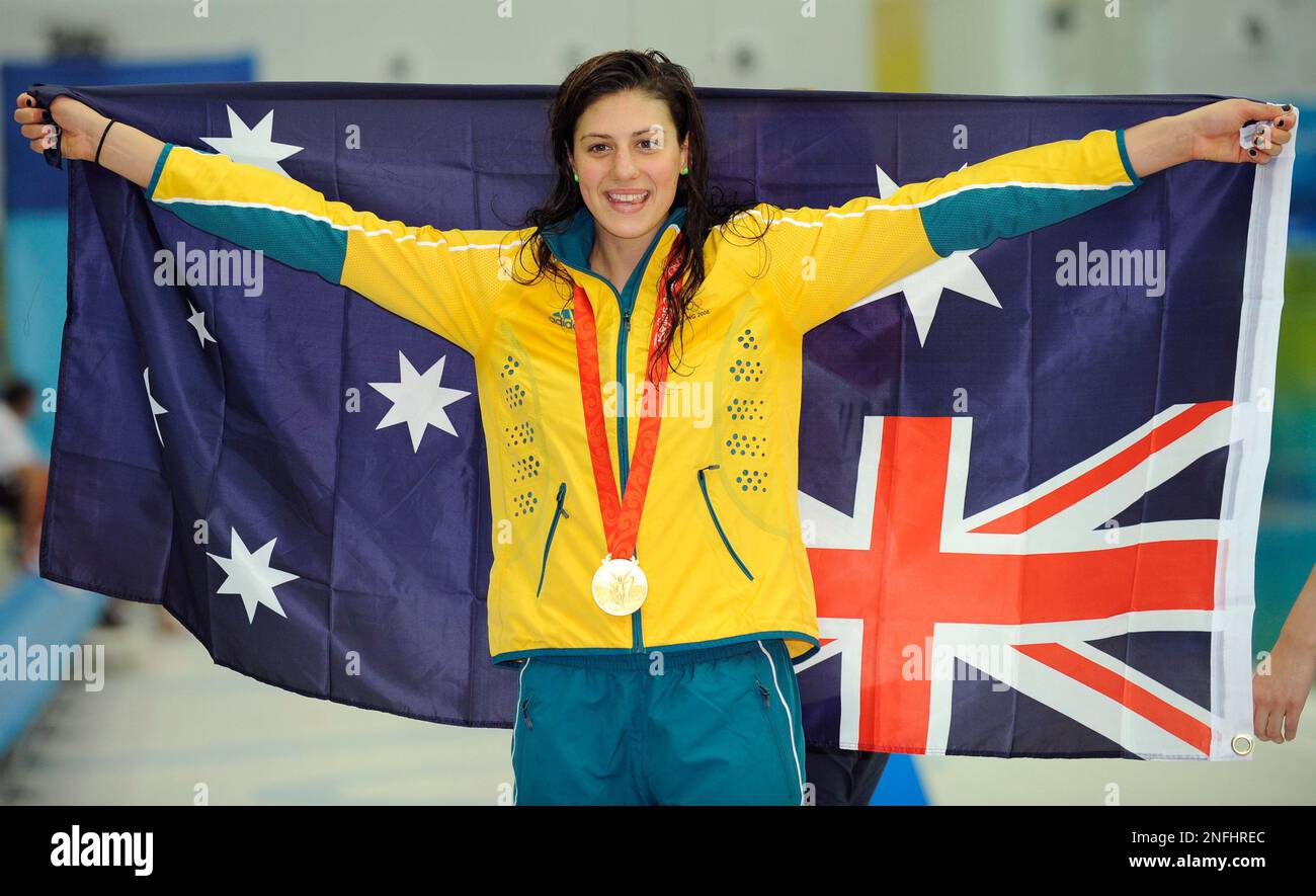 Gold medalist Stephanie Rice of Australia smiles with the medal and an ...
