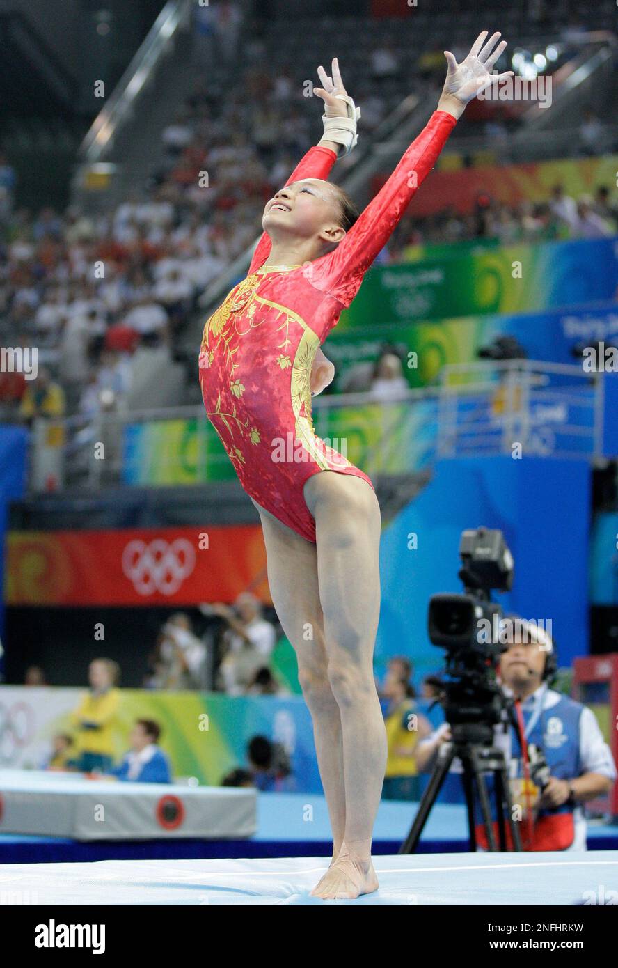 China's gymnast Deng Linlin lands after her performance on the vault ...