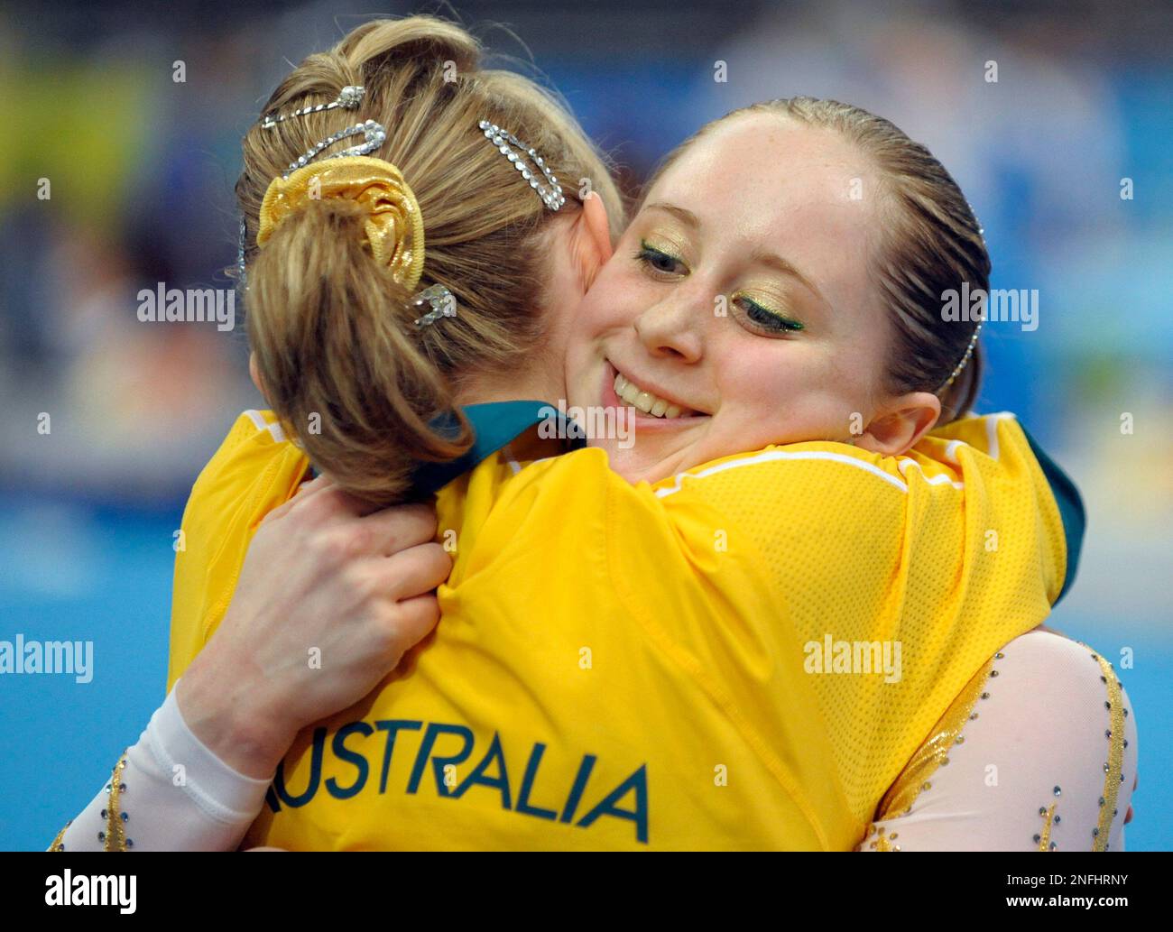 Australia's gymnast Shona Morgan, right, hugs a teammate during the ...