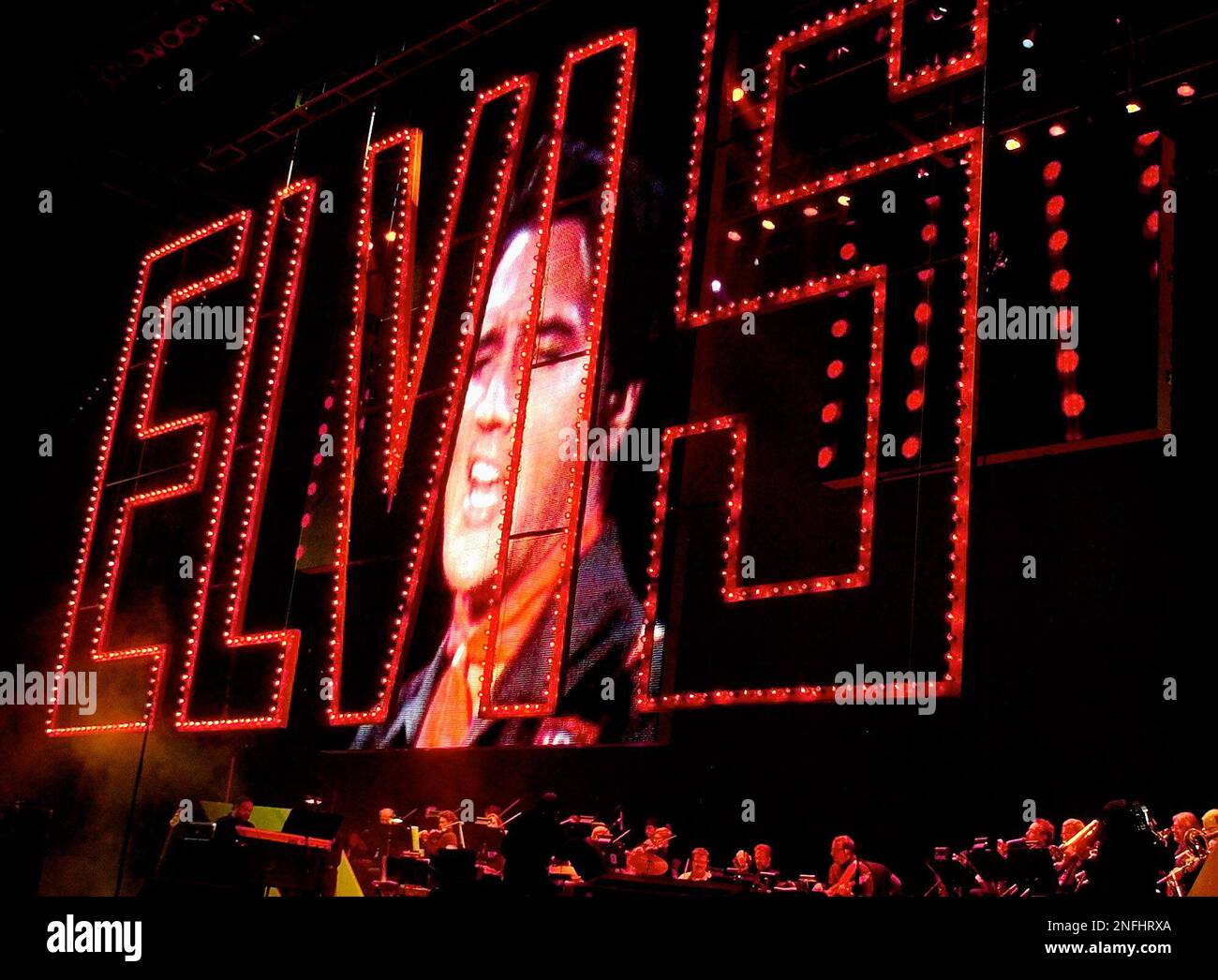 ** FILE ** In this Aug. 16, 2002 file photo, a projected image of Elvis ...