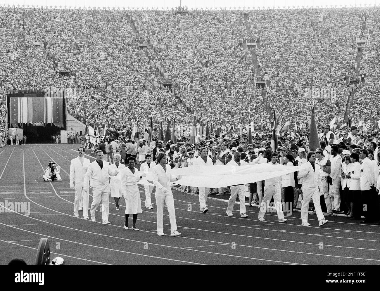 Former U.S. Olympians, including Bruce Jenner (center) prepare to raise ...