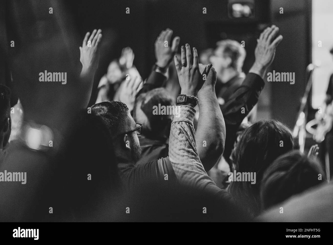 Hands in the air of people who praise God at church service Stock Photo ...