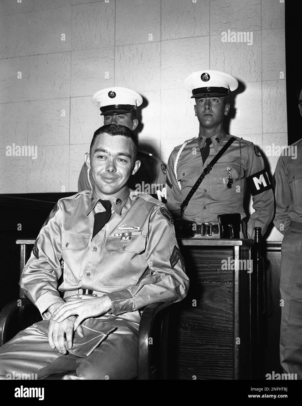 Cpl. Edward Dickenson poses in the witness chair with military ...