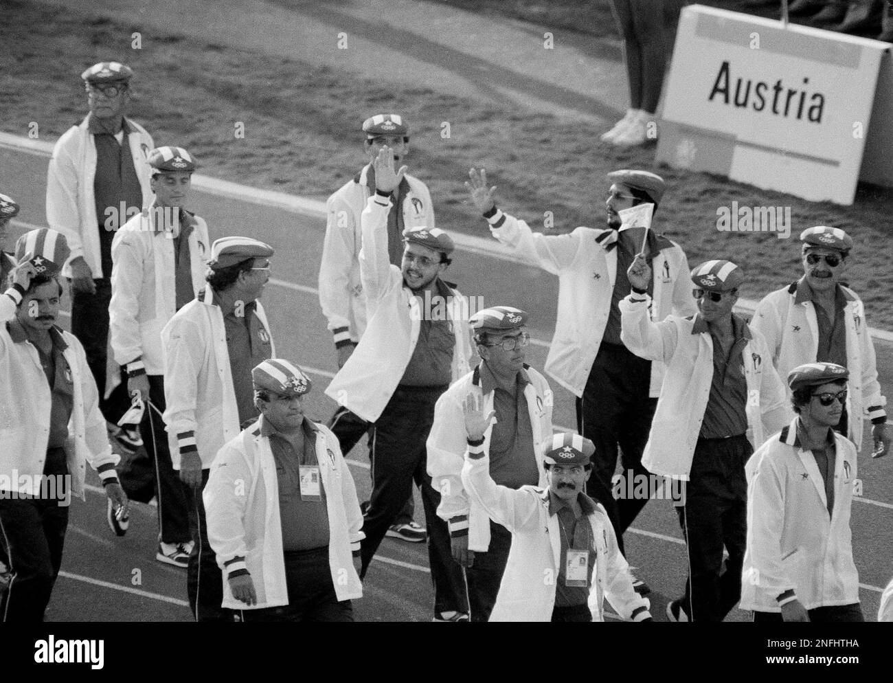 The Puerto Rican team waves to the crowd as they parade in the Coliseum ...