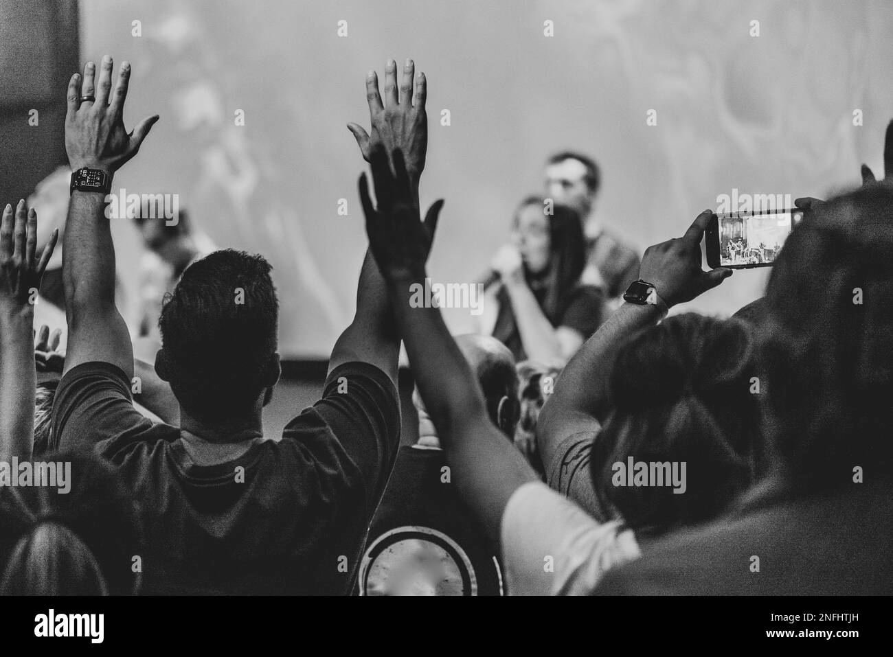 Hands in the air of people who praise God at church service Stock Photo ...