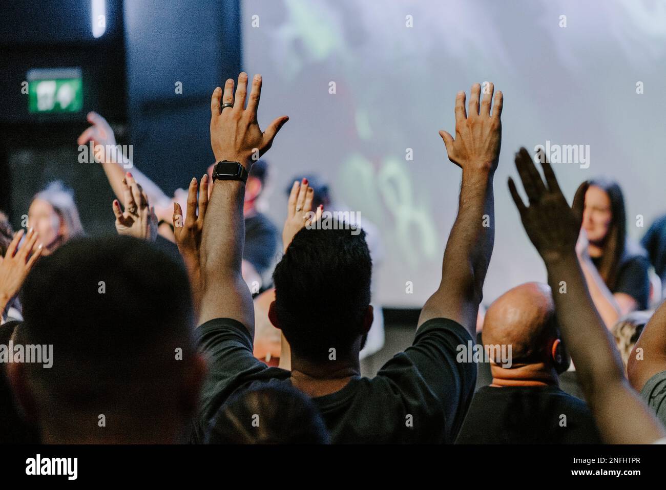 Hands in the air of people who praise God at church service Stock Photo ...