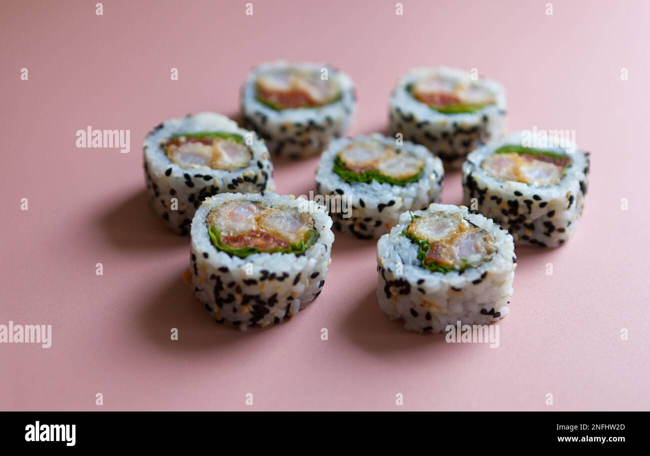 sushi rolls with shrimp on pink background. Tasty Food Photo. varieties ...