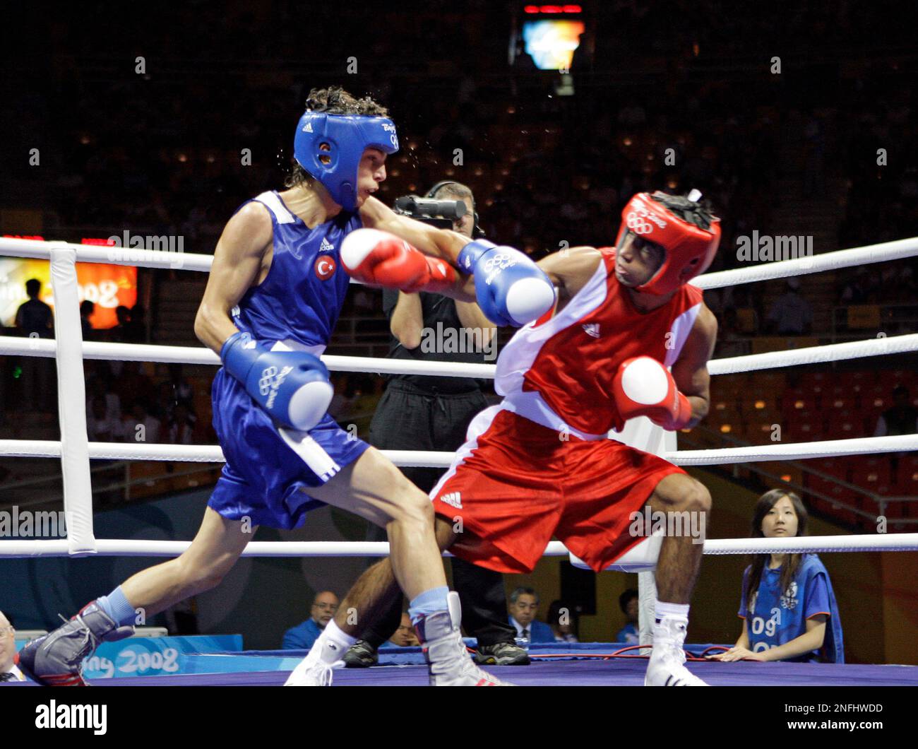 Akhil Kumar, red, of India and Furkan Ulas Memis, blue, of Turkey ...