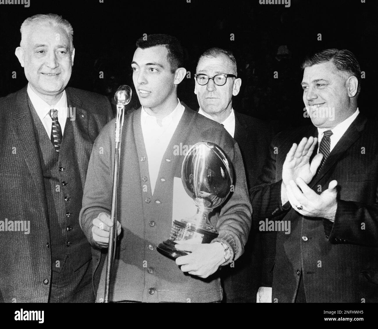 Ron VanderKelen, quarterback of the Wisconsin football team gives his ...