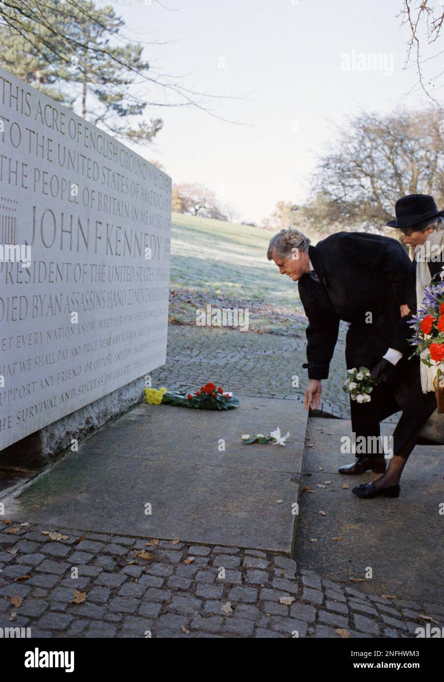 Sen. Edward Kennedy lays a white rose at the foot of a British memorial ...