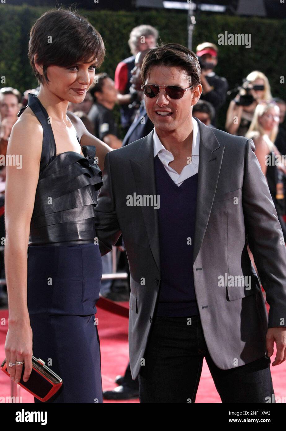 Actor Tom Cruise, right, and actress Katie Holmes pose on the press ...