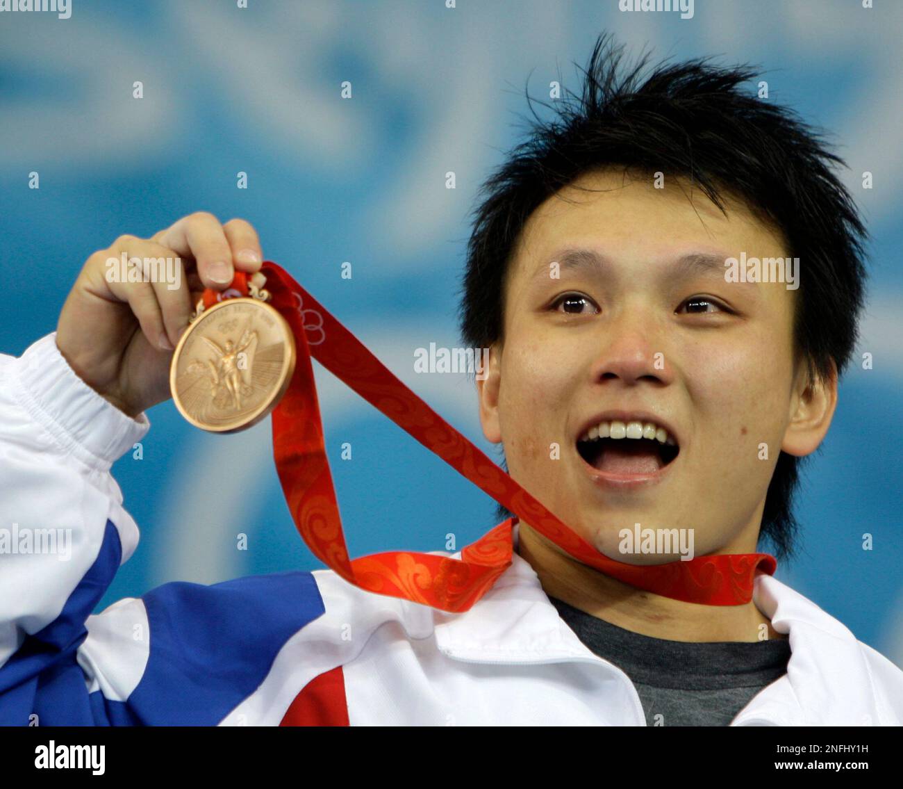 Lu Ying-Chi from Taiwan shows her bronze medal in the women's 63kg ...