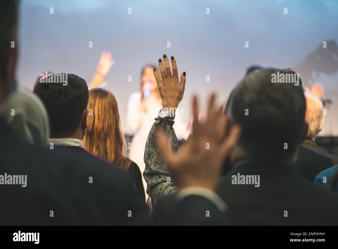Hands in the air of people who praise God at church service Stock Photo ...