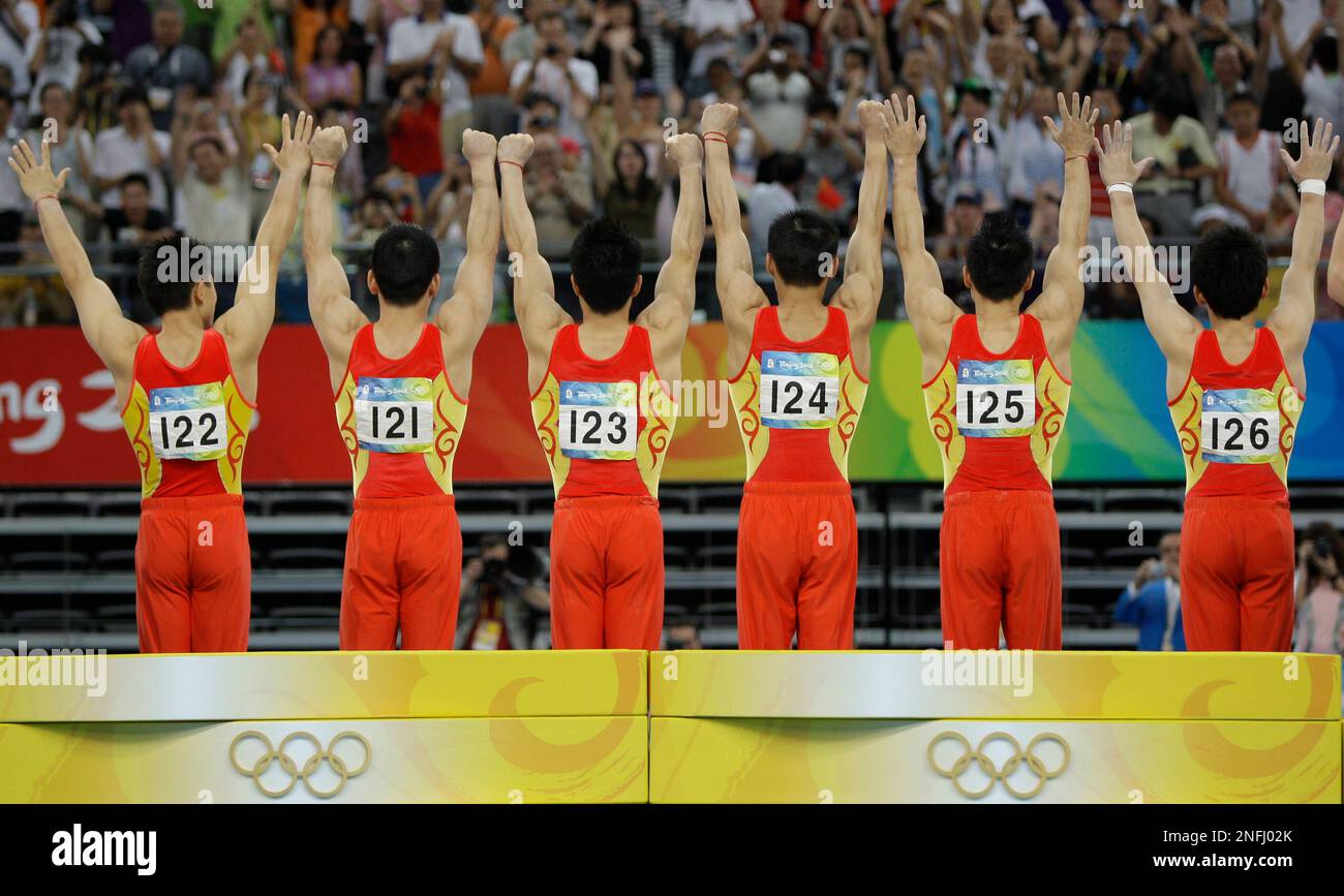 China's gymnasts Zou Kai, Yang Wei, Xiao Qin, Li Xiaopeng, Huang Xu and Chen Yibing, from right ...
