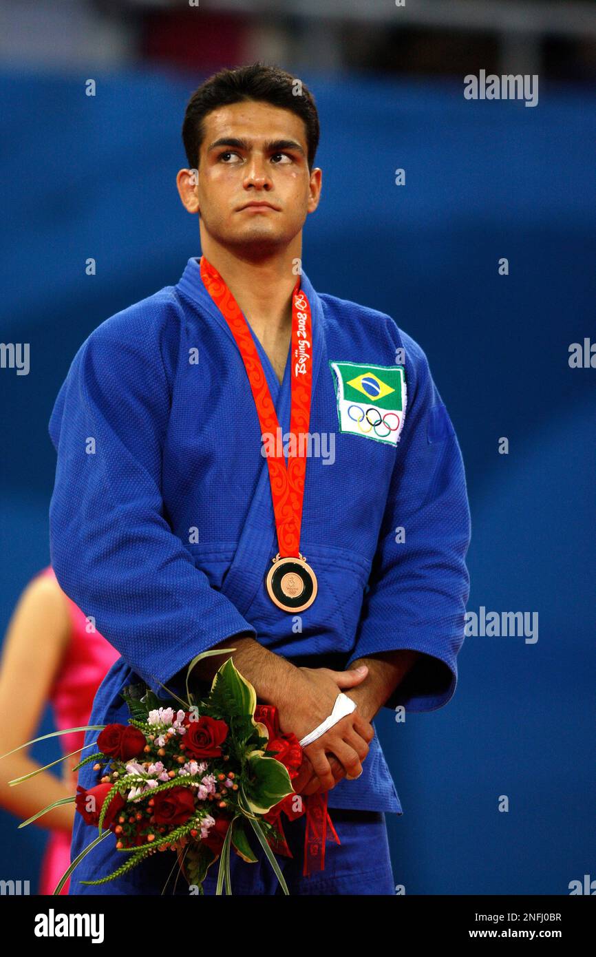 Bronze medalist Leandro Guilheiro from Brazil stands with his medal at ...