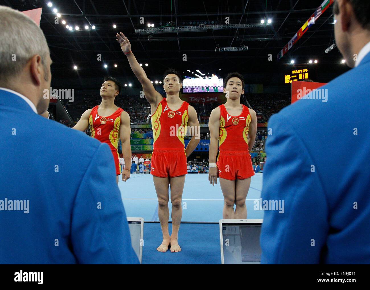 China's gymnasts Chen Yibin, Yang Wei and Zou Kai, from left, pose ...