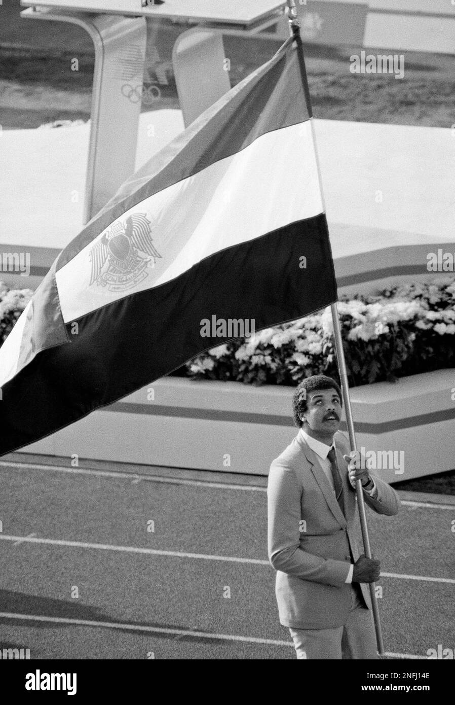 Egyptian basketball player Mohamed Soliman bears the flag of his ...