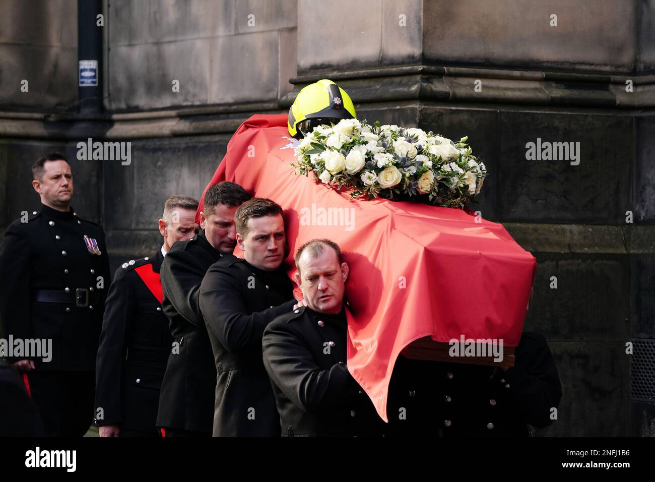 The coffin of Barry Martin is carried out of St Giles' Cathedral in ...