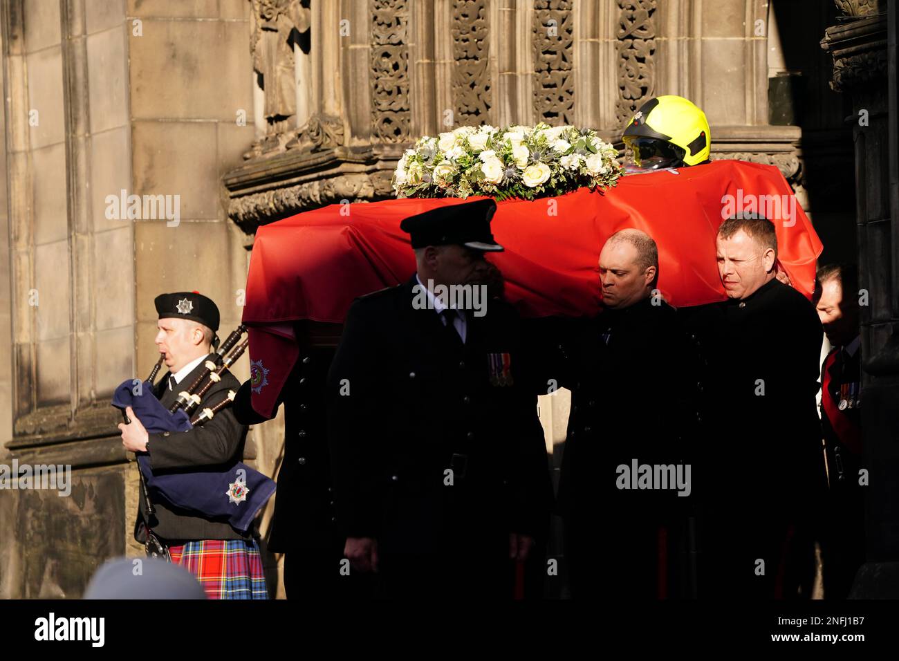 The coffin of Barry Martin is carried out of St Giles' Cathedral in ...