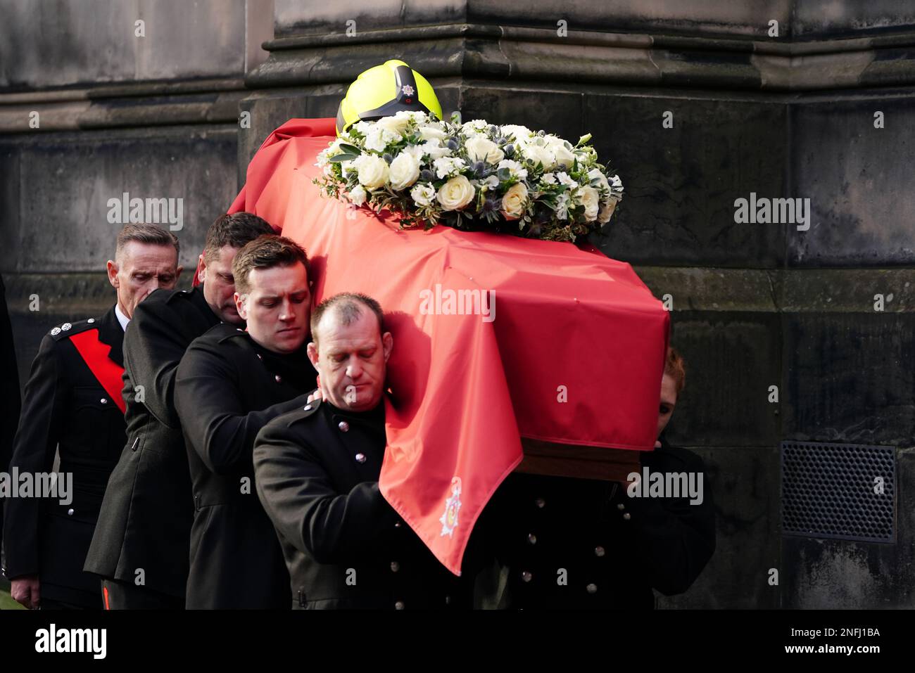 The coffin of Barry Martin is carried out of St Giles' Cathedral in ...