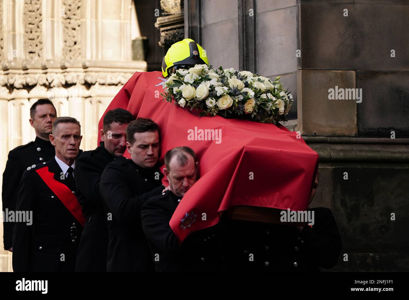 The coffin of Barry Martin is carried out of St Giles' Cathedral in ...