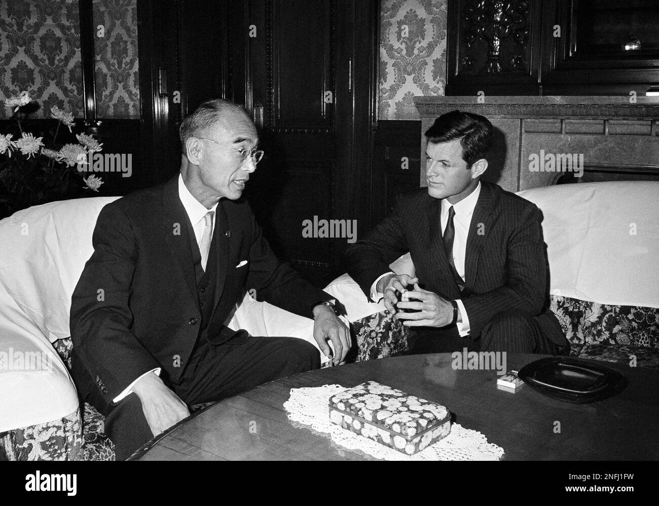 Sen. Edward M. Kennedy of Massachusetts talks with Naka Funada, speaker ...
