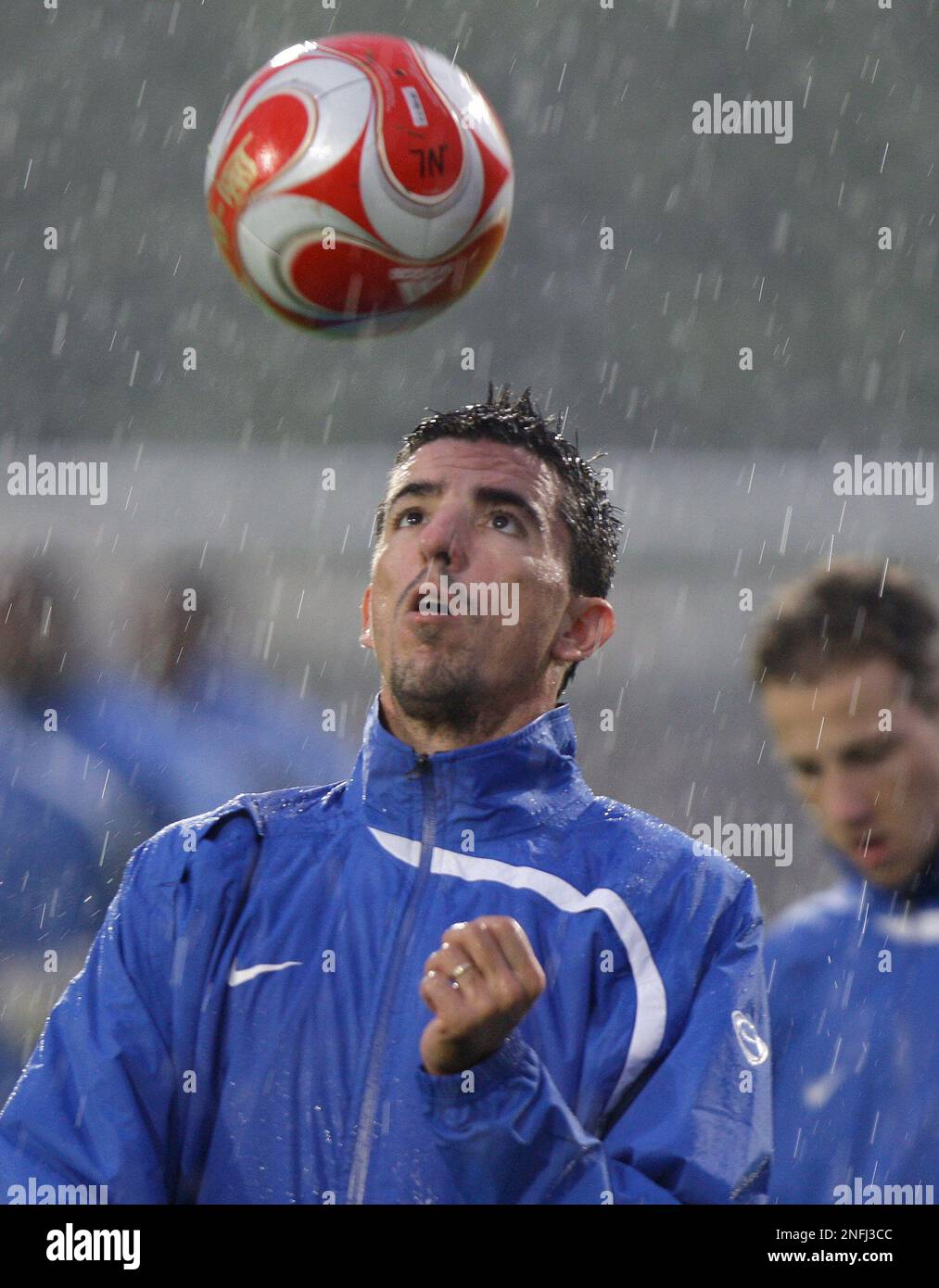 The Netherlands' soccer player, Roy Makaay, controls the ball under ...